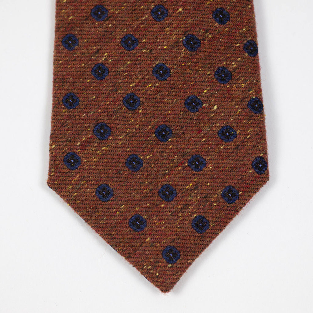 Rust silk and wool donegal tie, navy neat motifs – No Man Walks Alone
